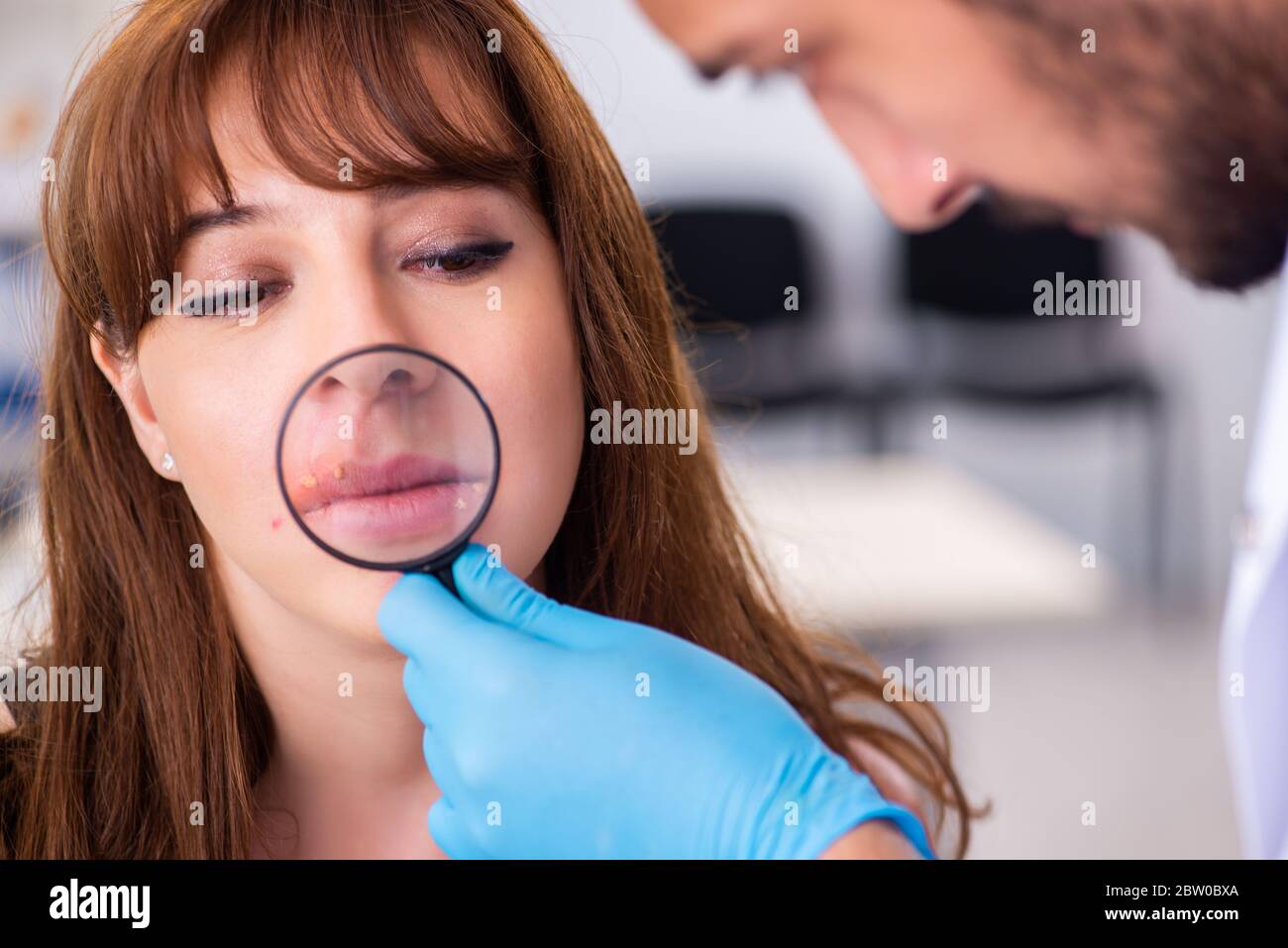 Young woman visiting doctor dermatologist Stock Photo - Alamy