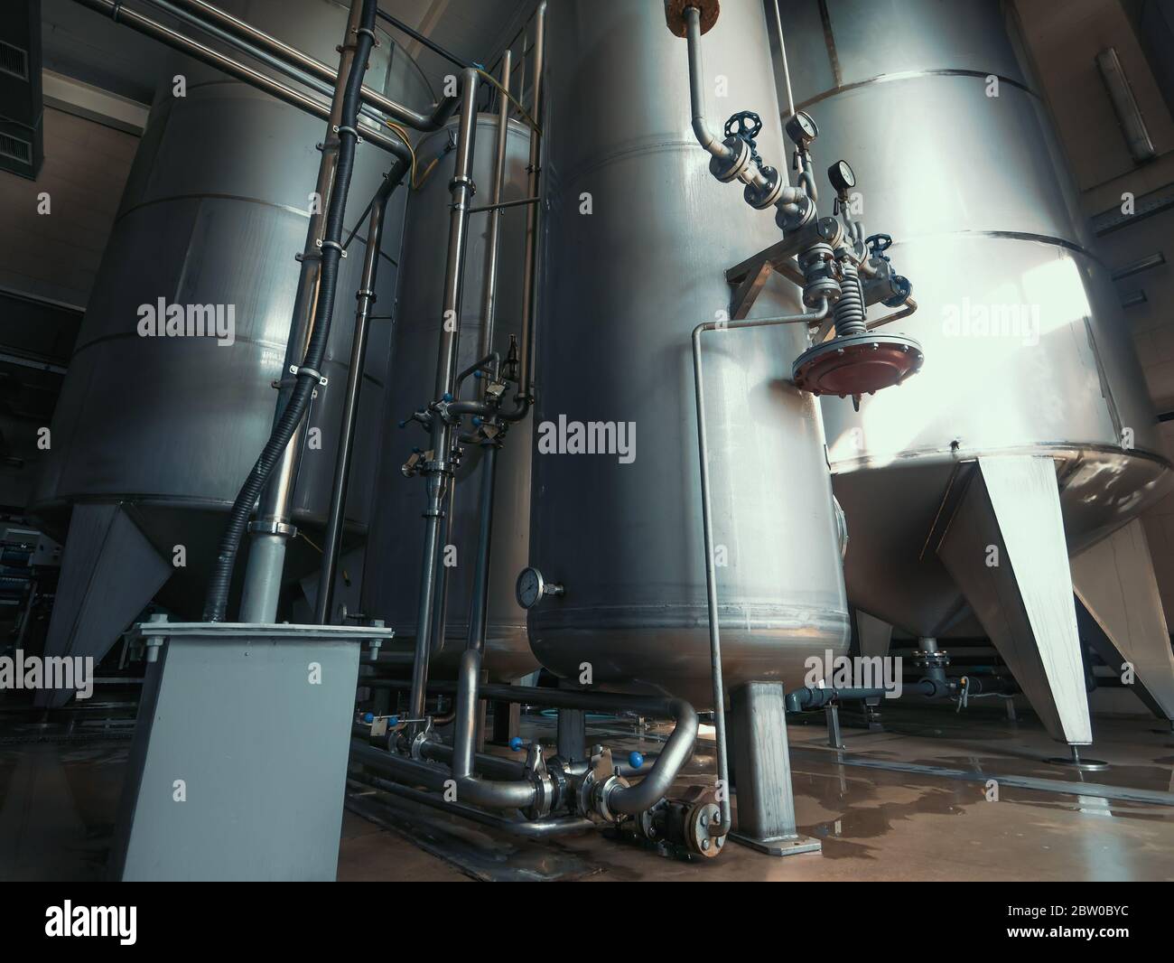 Drinking water factory production, industrial interior. Large metal ...