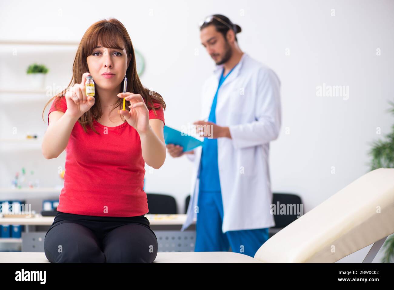 Female diabetic patient visiting young doctor Stock Photo - Alamy