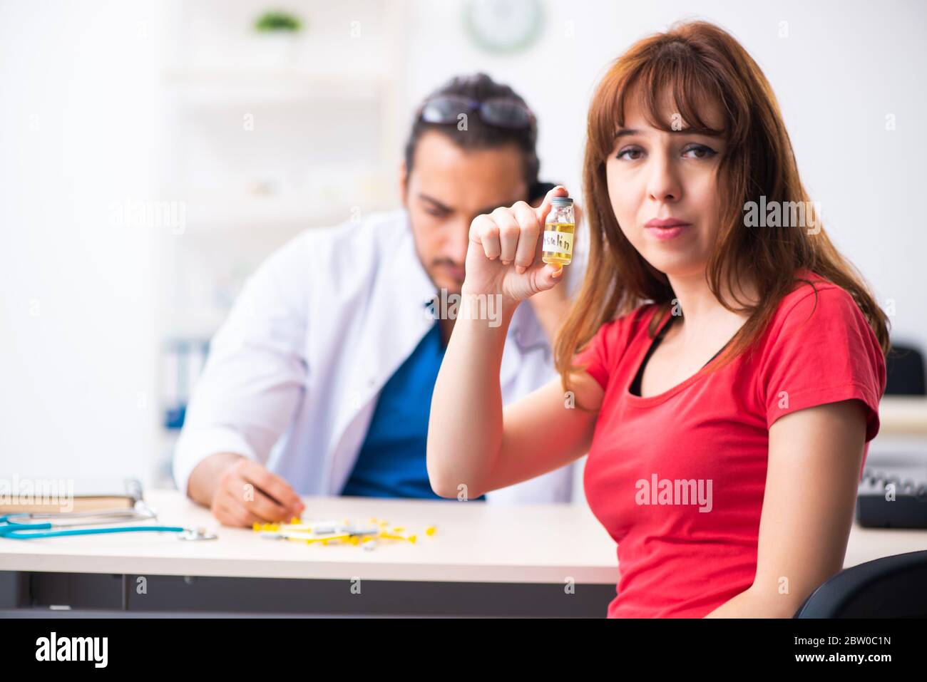 Female diabetic patient visiting young doctor Stock Photo - Alamy
