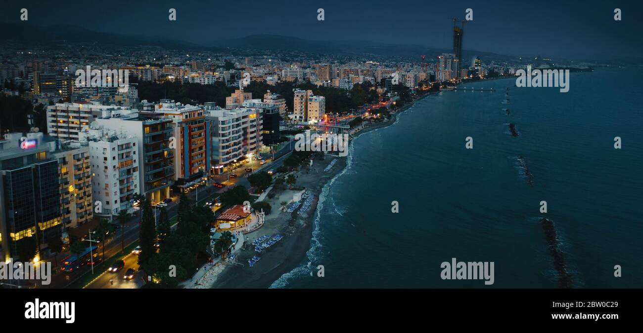 Aerial panorama of night Limassol waterfront, promenade Molos Park ...