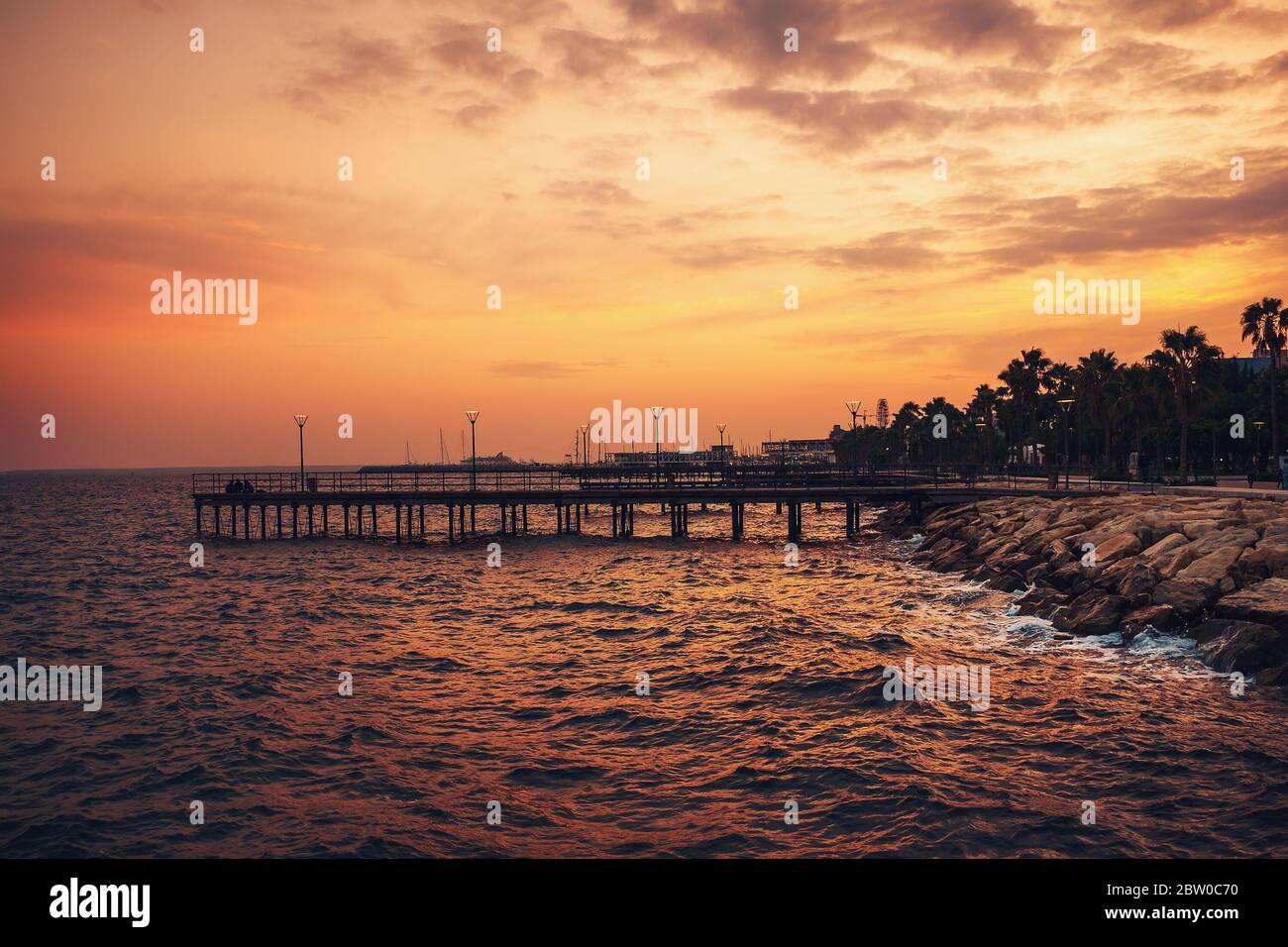 Dramatic sunset in Cyprus. Limassol pier and evening sea. Mediterranean ...