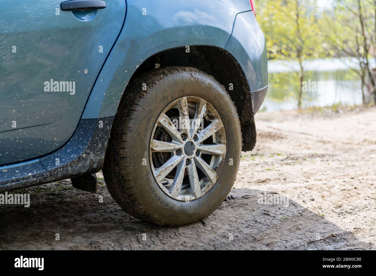 Dirty car wheel closeup in a countryside road. Off road concept. 4x4 ...
