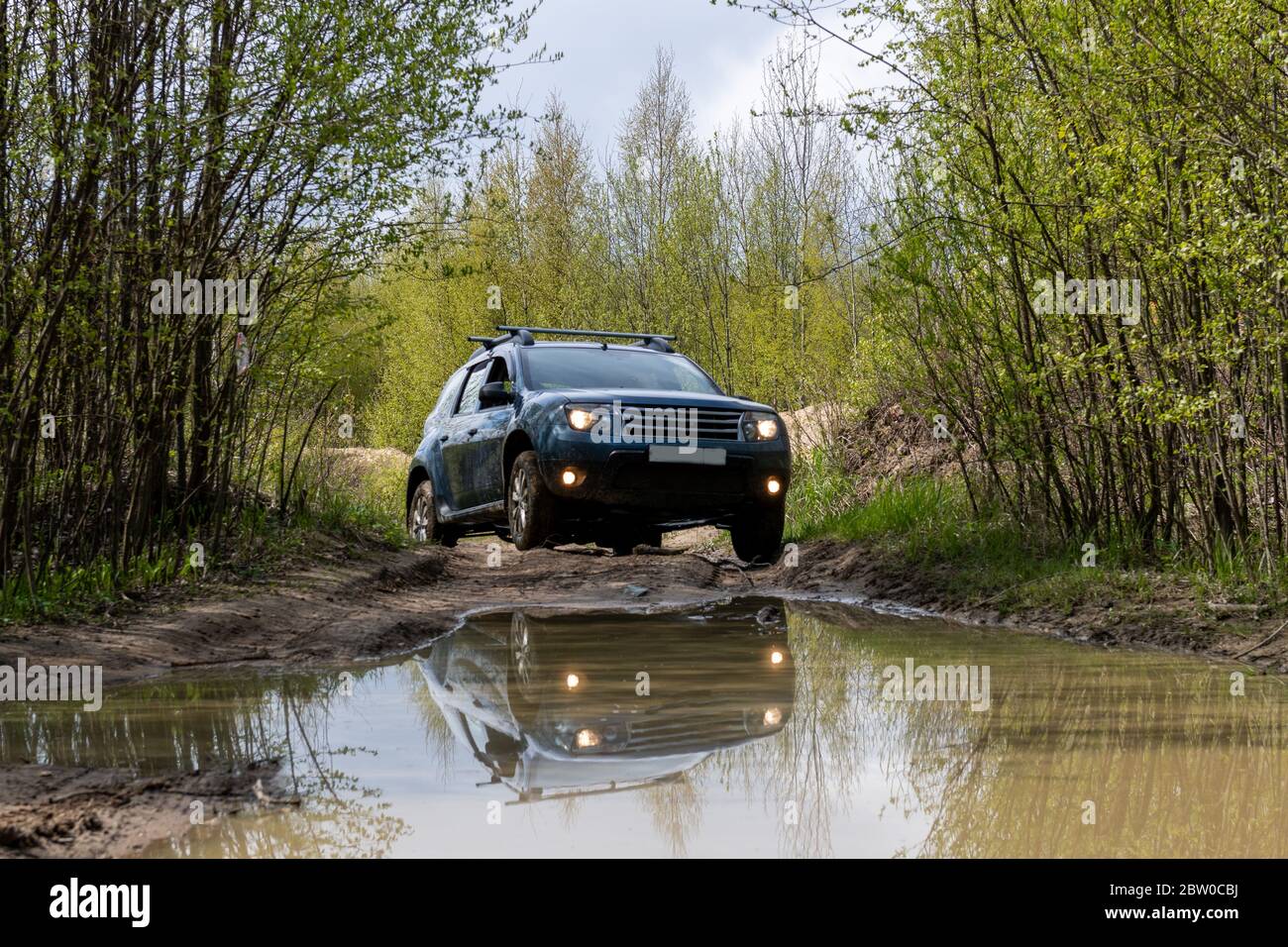 Dirty car on muddy road in a forest. Off road concept. 4x4 Stock Photo ...