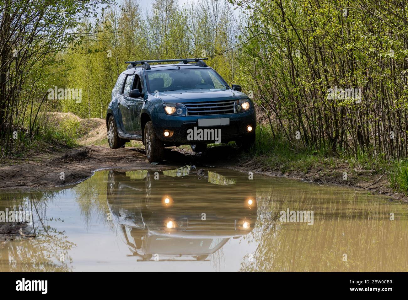 Dirty car on muddy road in a forest. Off road concept. 4x4 Stock Photo ...