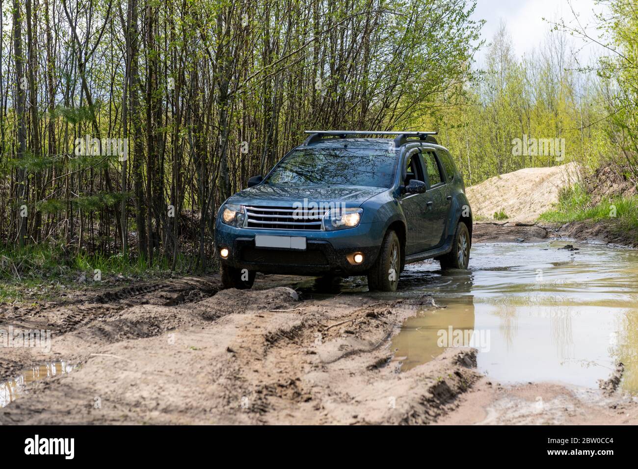 Dirty car on muddy road in a forest. Off road concept. 4x4 Stock Photo ...