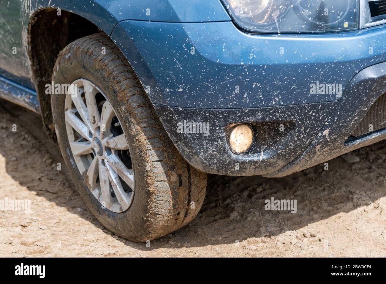 Dirty car wheel closeup in a countryside road. Off road concept. 4x4 ...