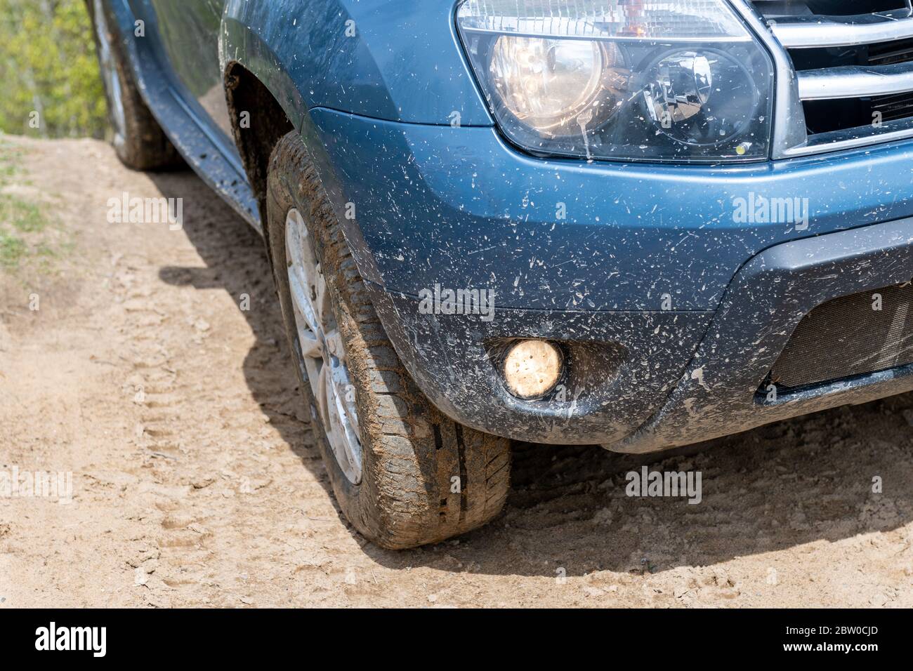 Dirty car wheel closeup in a countryside road. Off road concept. 4x4 ...