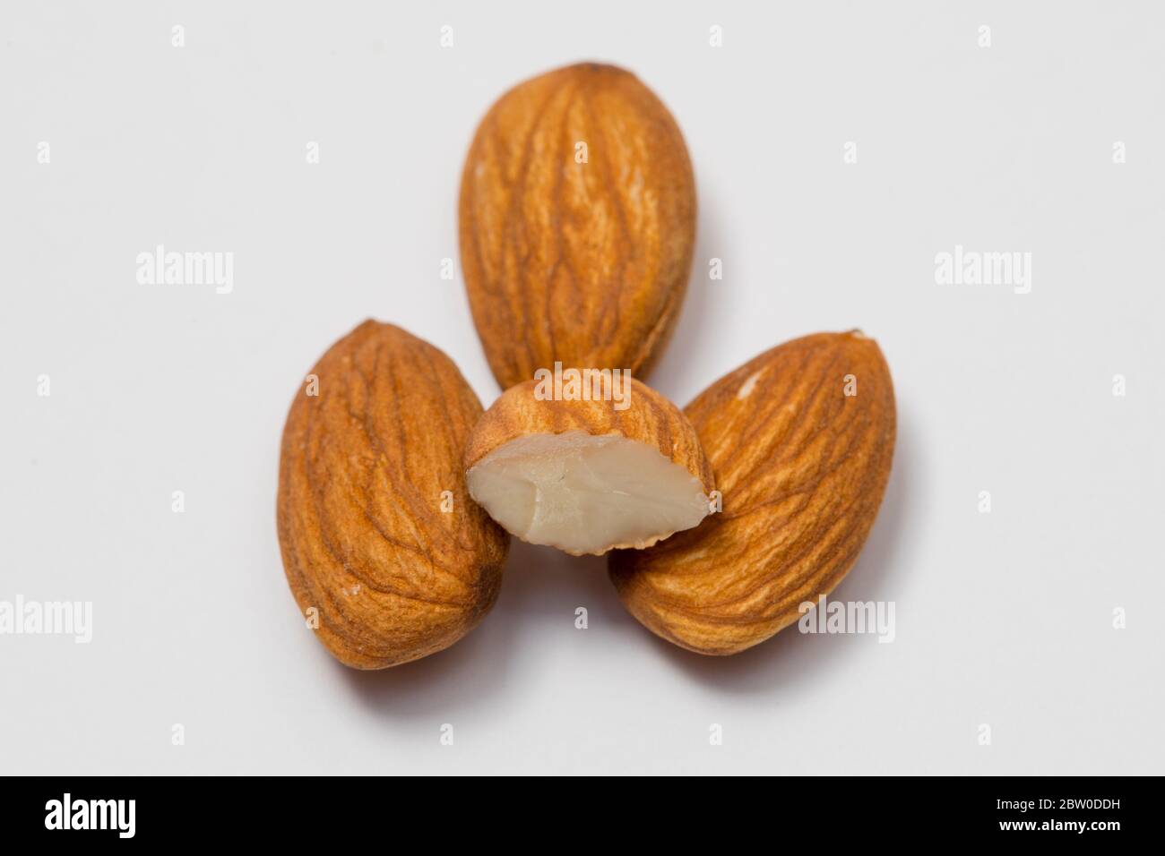 Close-up view of almonds on white background Stock Photo - Alamy