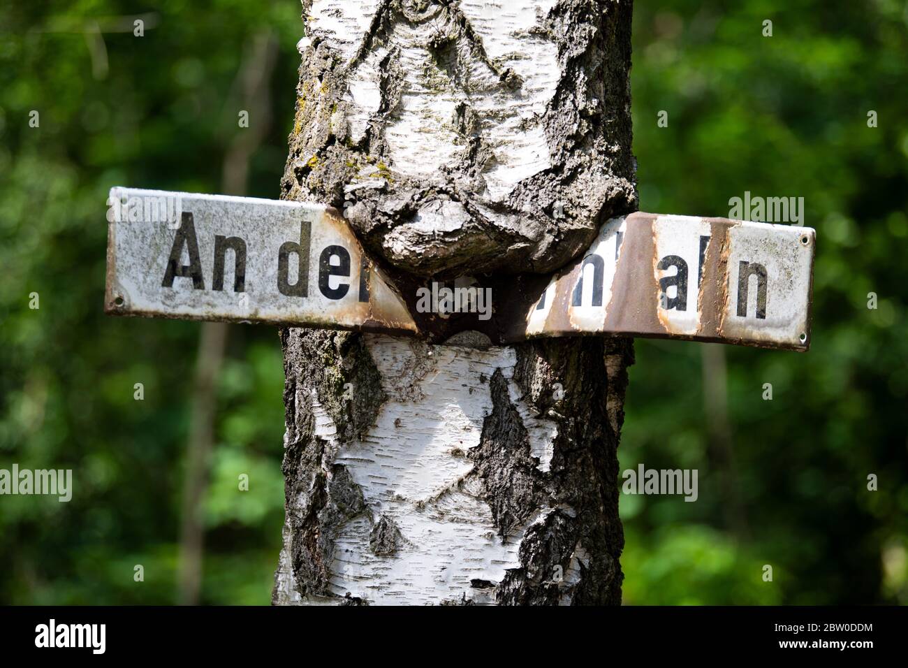 27 May 2020, Brandenburg, Kleinmachnow: A weathered and dented sign ...