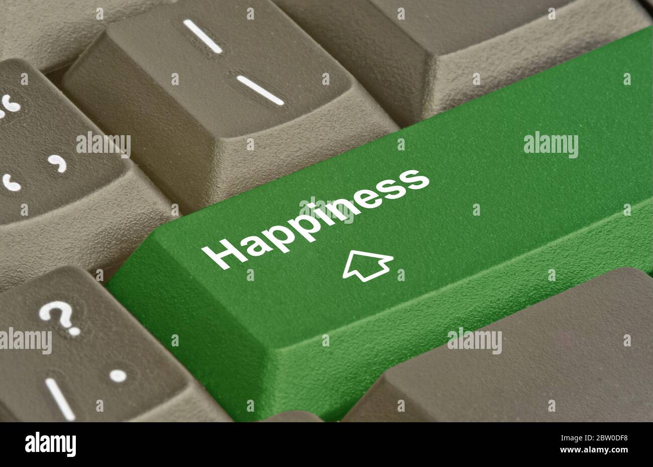 Keyboard with green key for happiness Stock Photo - Alamy