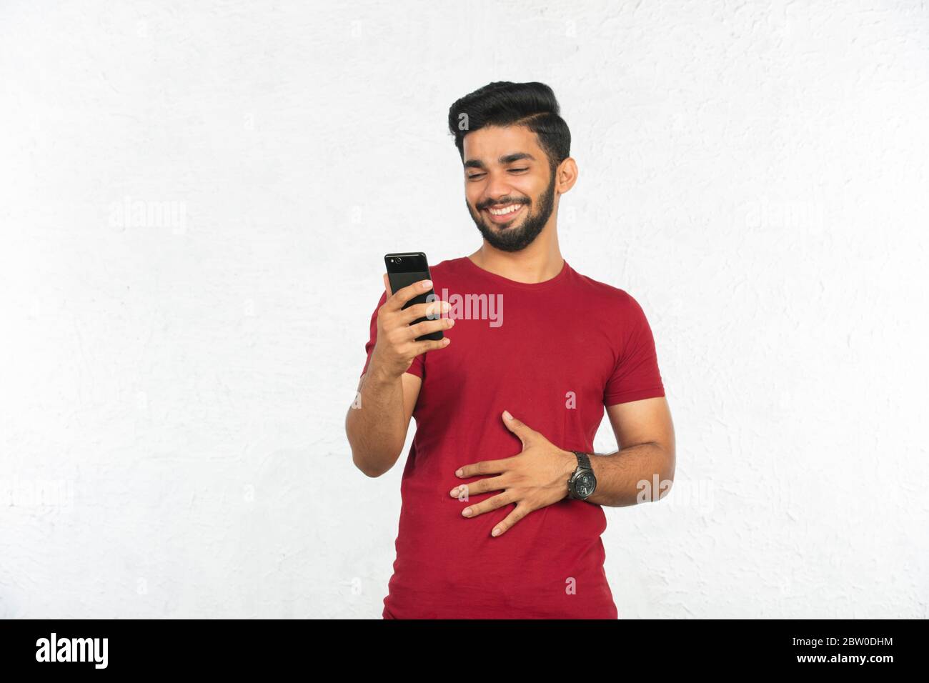 Young indian man smiling hi-res stock photography and images - Alamy
