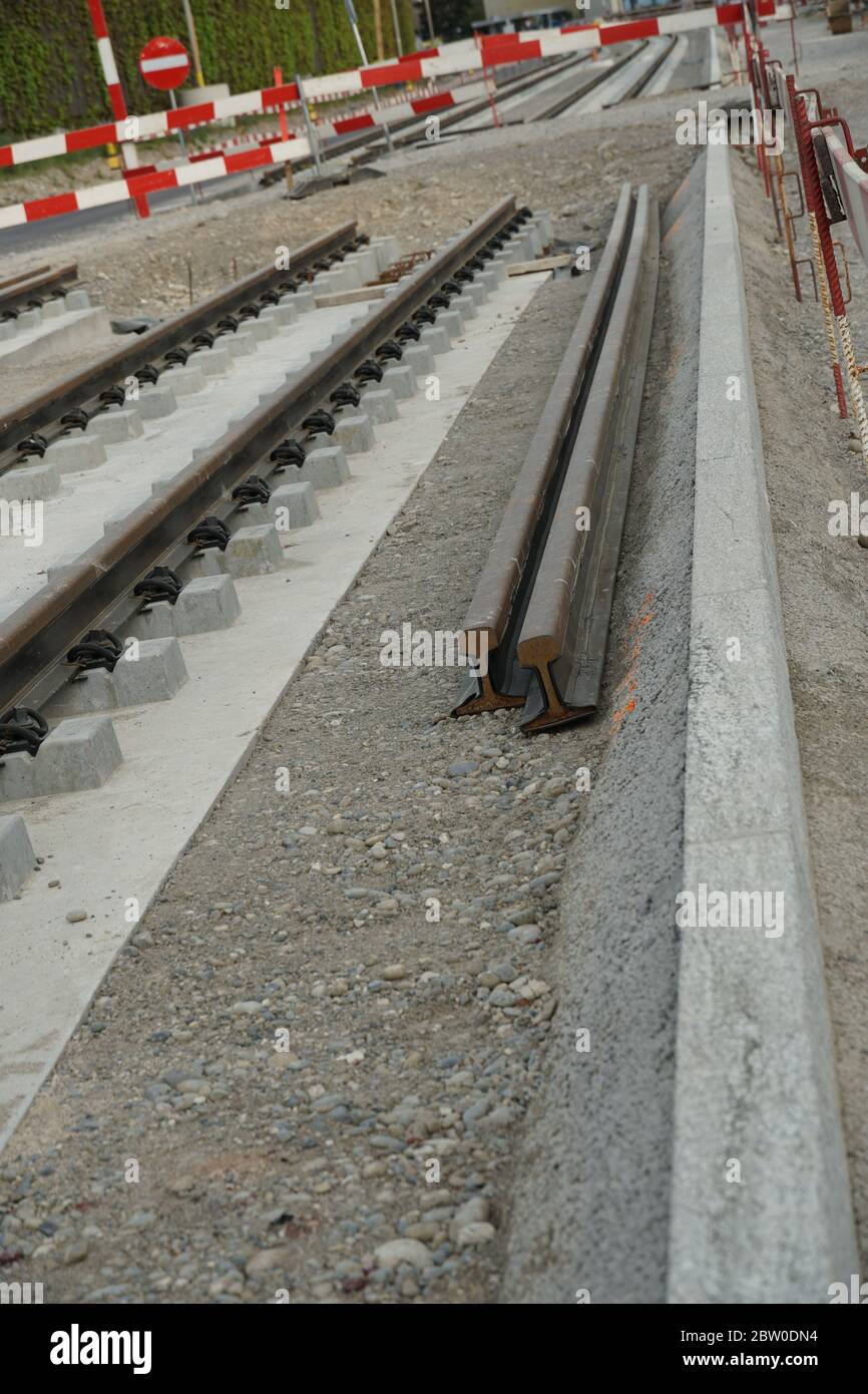 new tram line rails installed in the ground on a concrete base and some ...