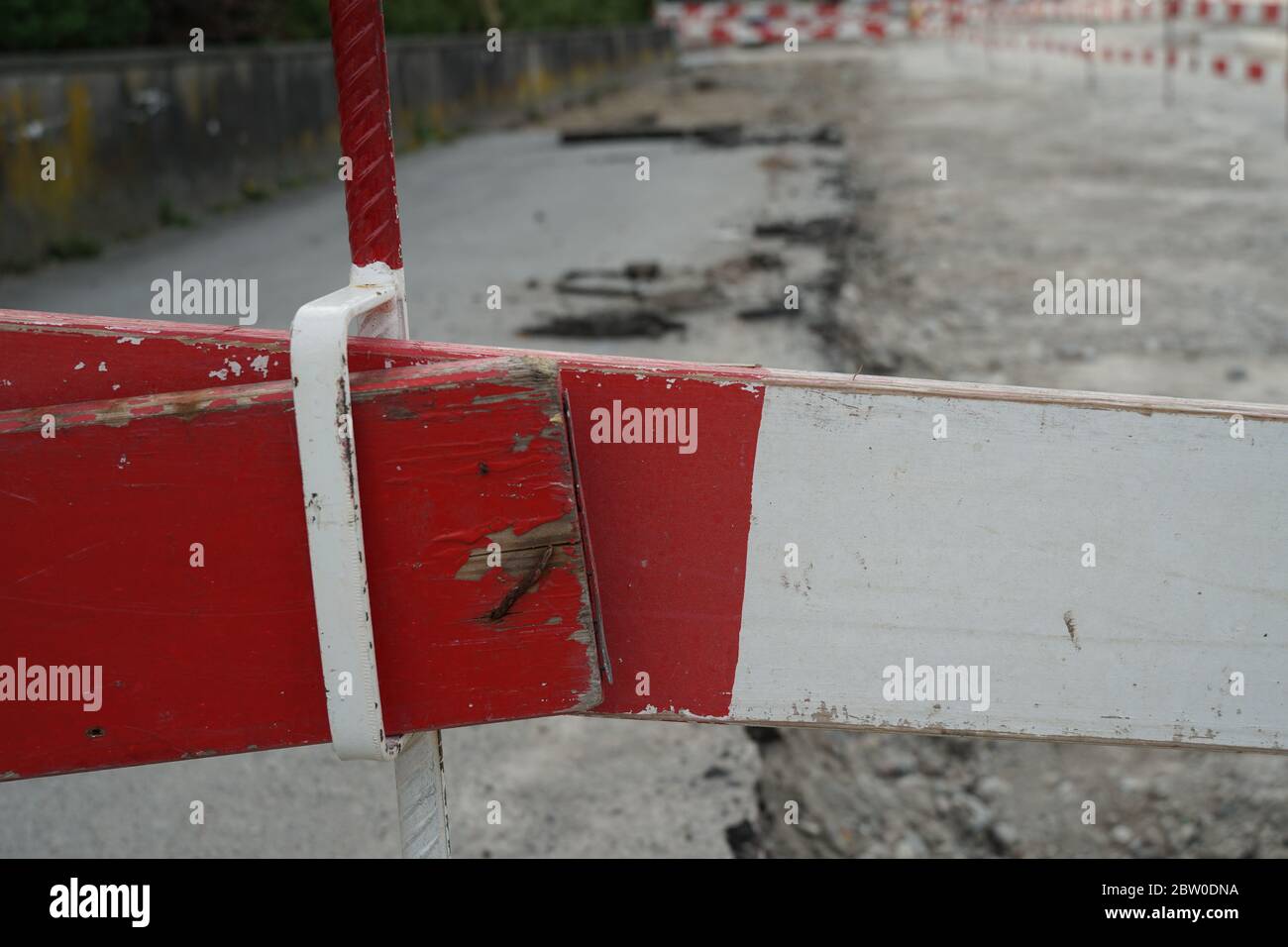 two construction barrier planks of red and white close-up fixed ...