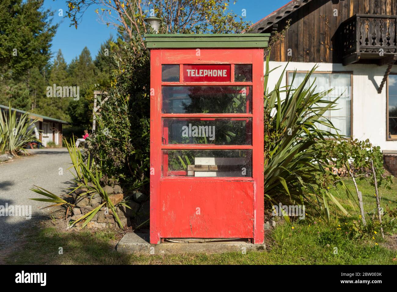 An old homemade red telephone box on a campsite in Manapouris New ...