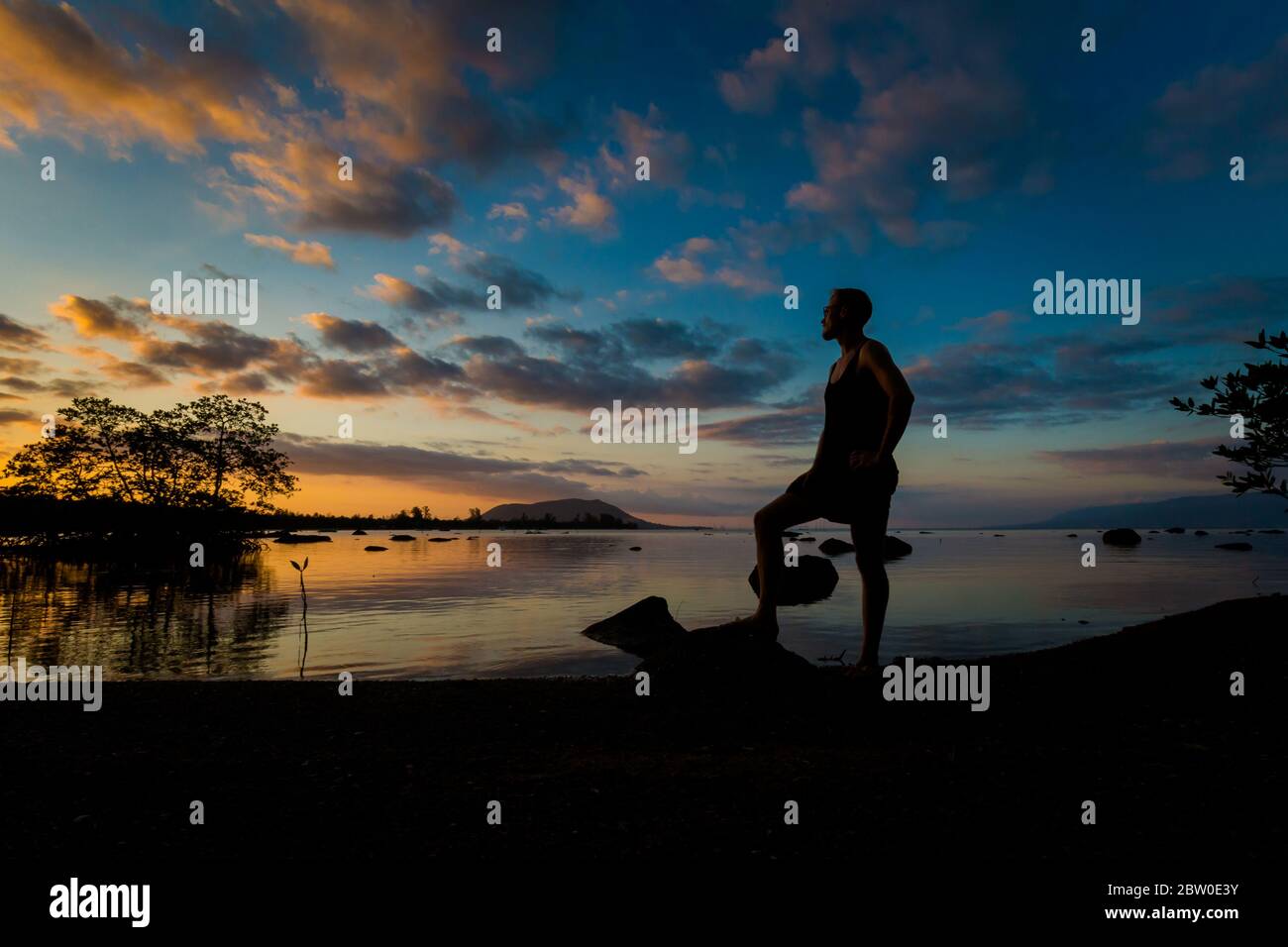 Goodlooking man watching summer sunset on tropical Phu Quoc, Hon Mot ...