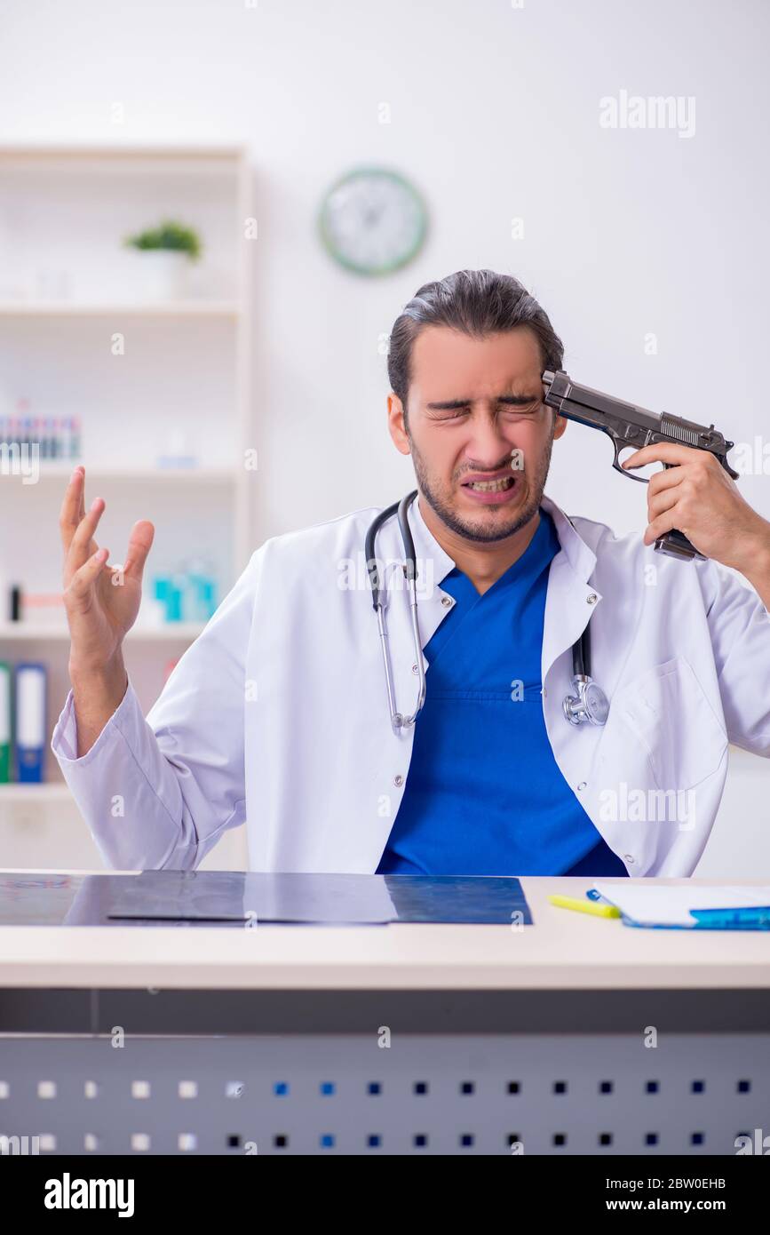 Young doctor being tired after night shift Stock Photo - Alamy