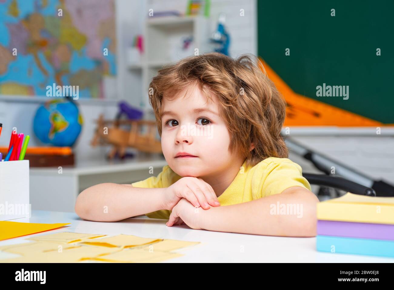 Friendly child in classroom hi-res stock photography and images - Alamy