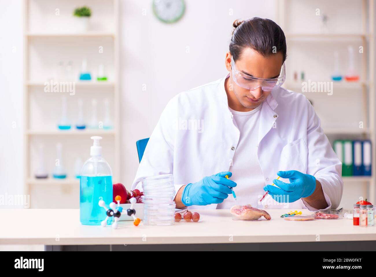 Young nutrition expert testing food products in lab Stock Photo - Alamy