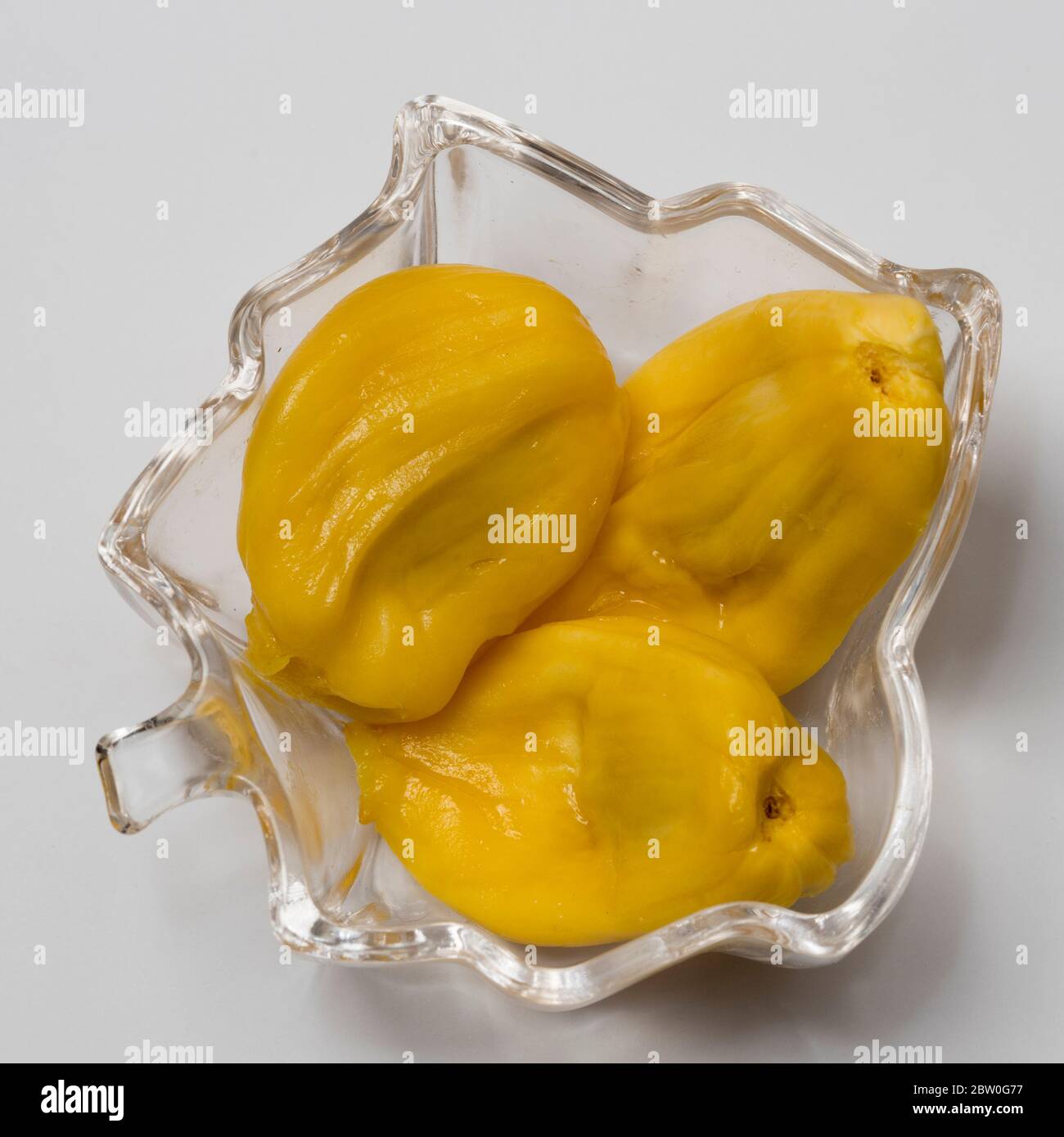 Ripe jackfruit in a glass bowl on white background Stock Photo - Alamy