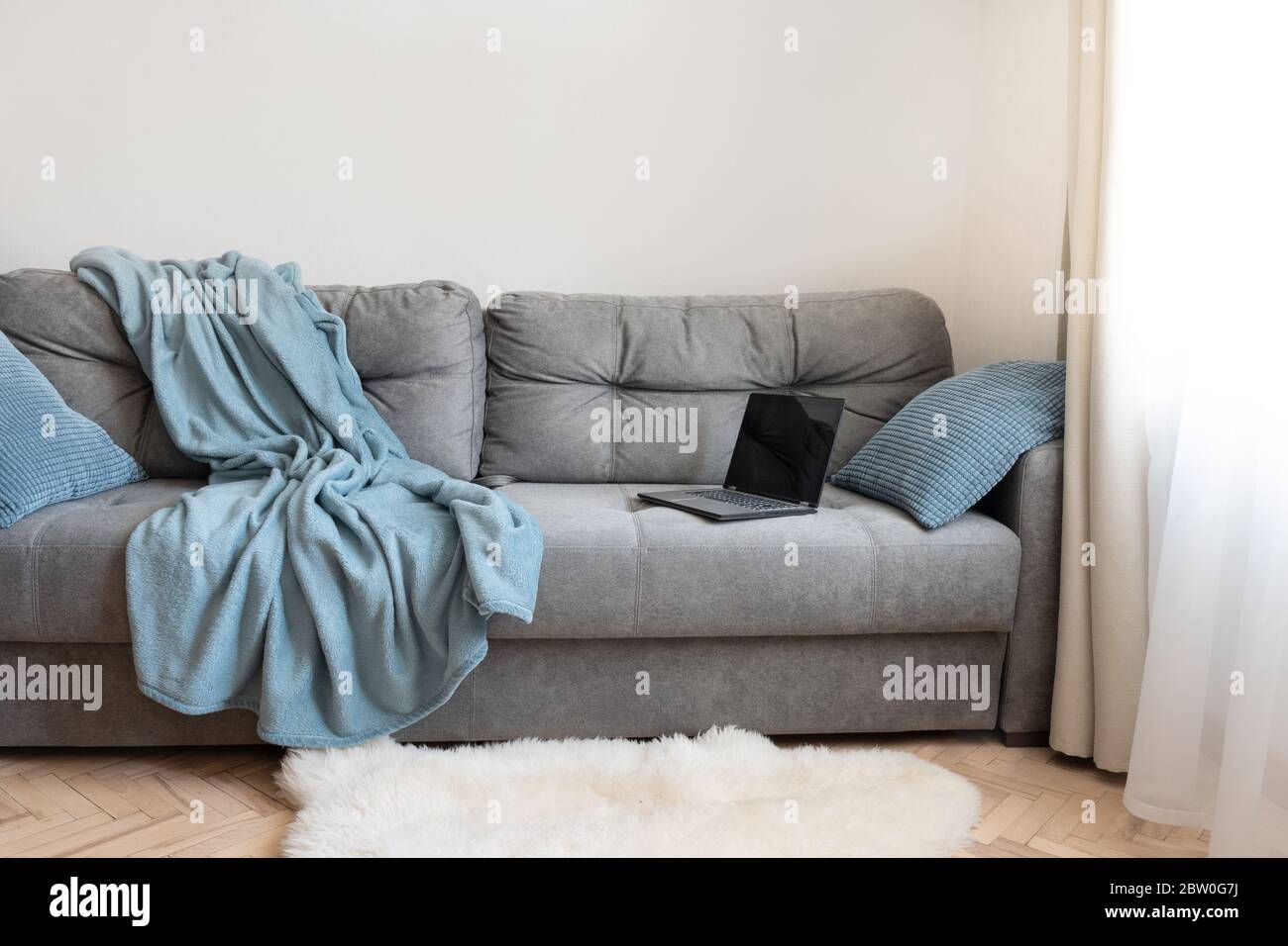 Living room. Laptop on sofa. Home cozy interior. Stay at home. Self ...