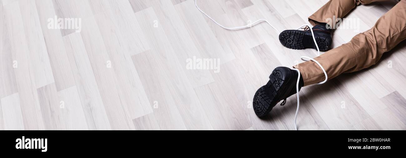 Trip And Fall Electrician. Fallen Person On Floor Stock Photo - Alamy