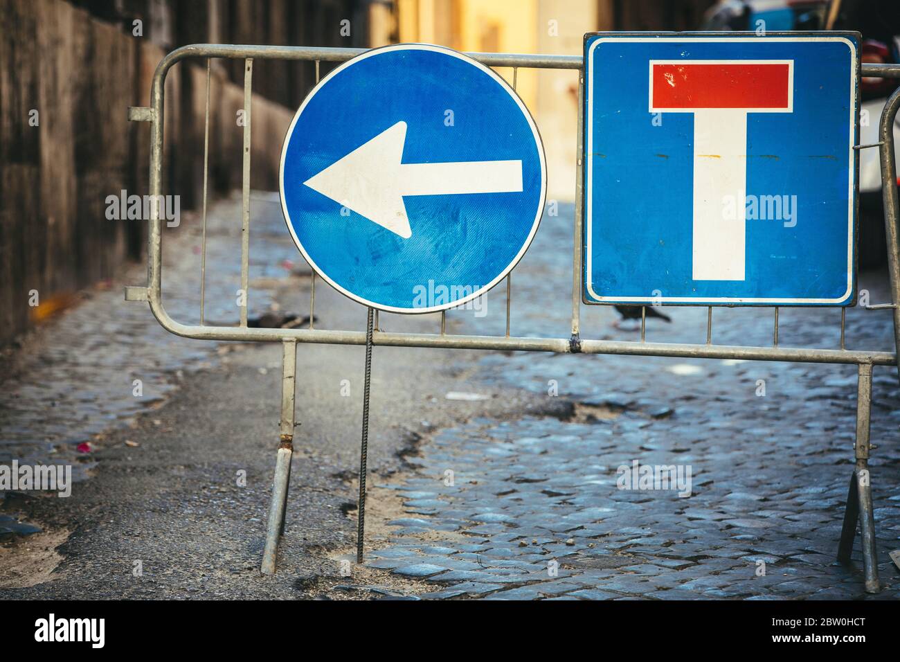 Road works detour road signs. Dead end road and arrow to turn left ...