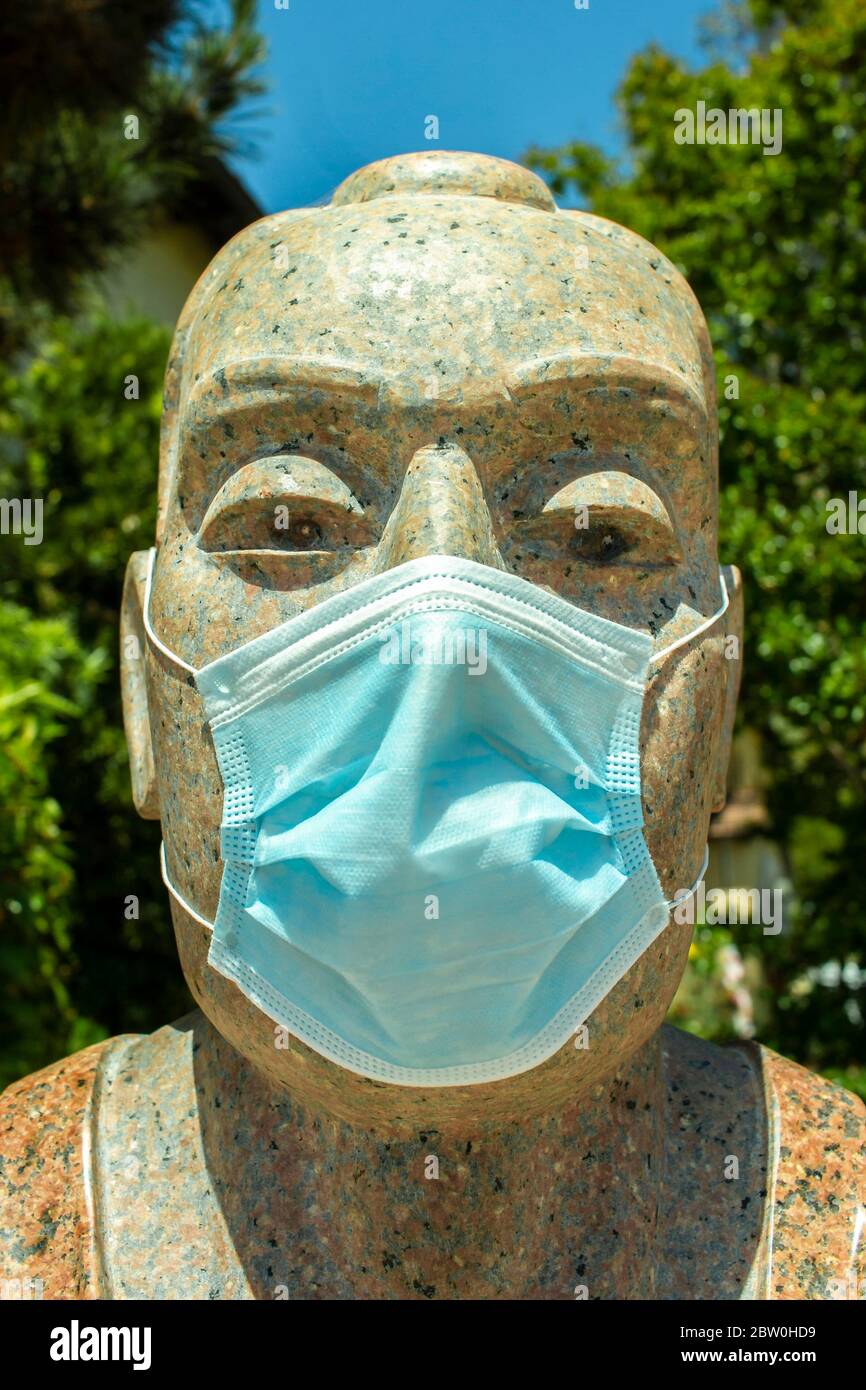 Sculpture statue is wearing a face mask hi-res stock photography and ...