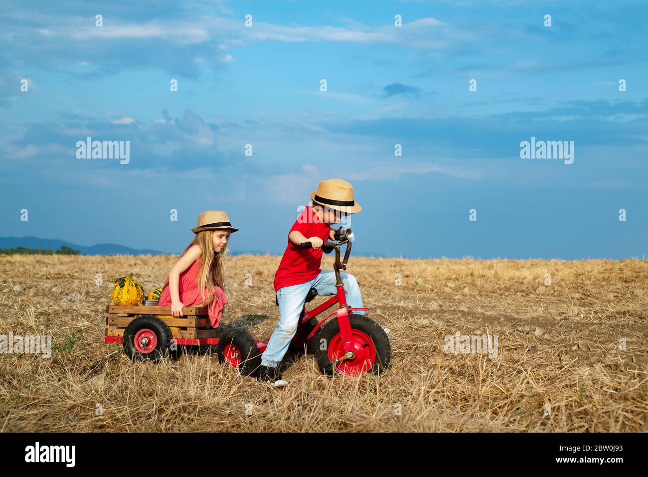 Little farmers kids in village. Beautiful children is riding the ...