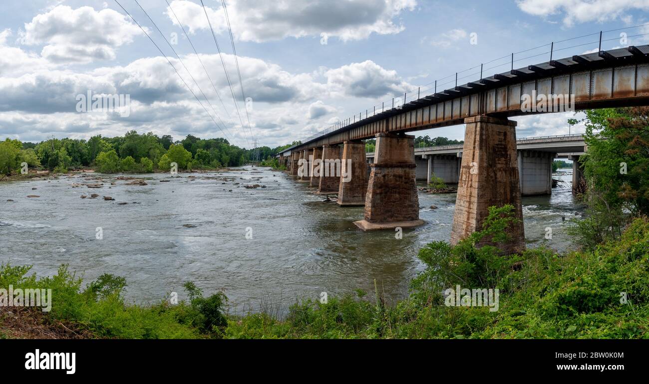 A railroad bridge made from stone and metal crossing the Broad River in ...