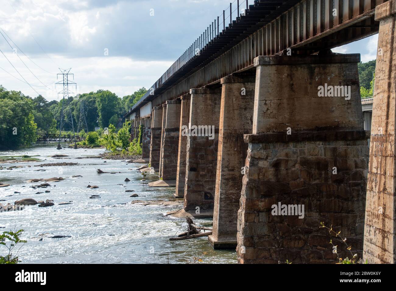 A railroad bridge made from stone and metal crossing the Broad River in ...