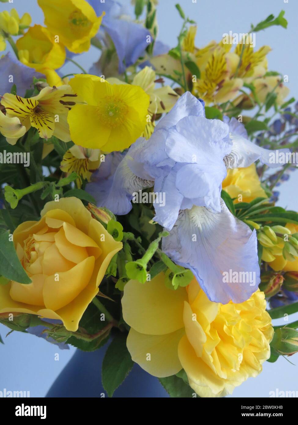 A large bouquet of fresh flowers in a floral arrangement of yellows and ...