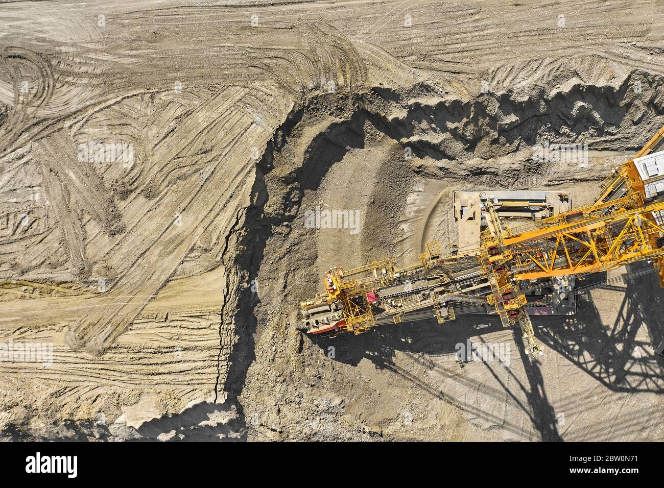 Aerial view of large heavy equipment machine mining natural resource ...