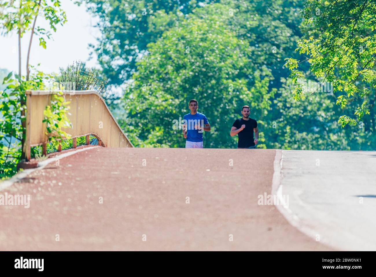 Boys running through forest hi-res stock photography and images - Alamy
