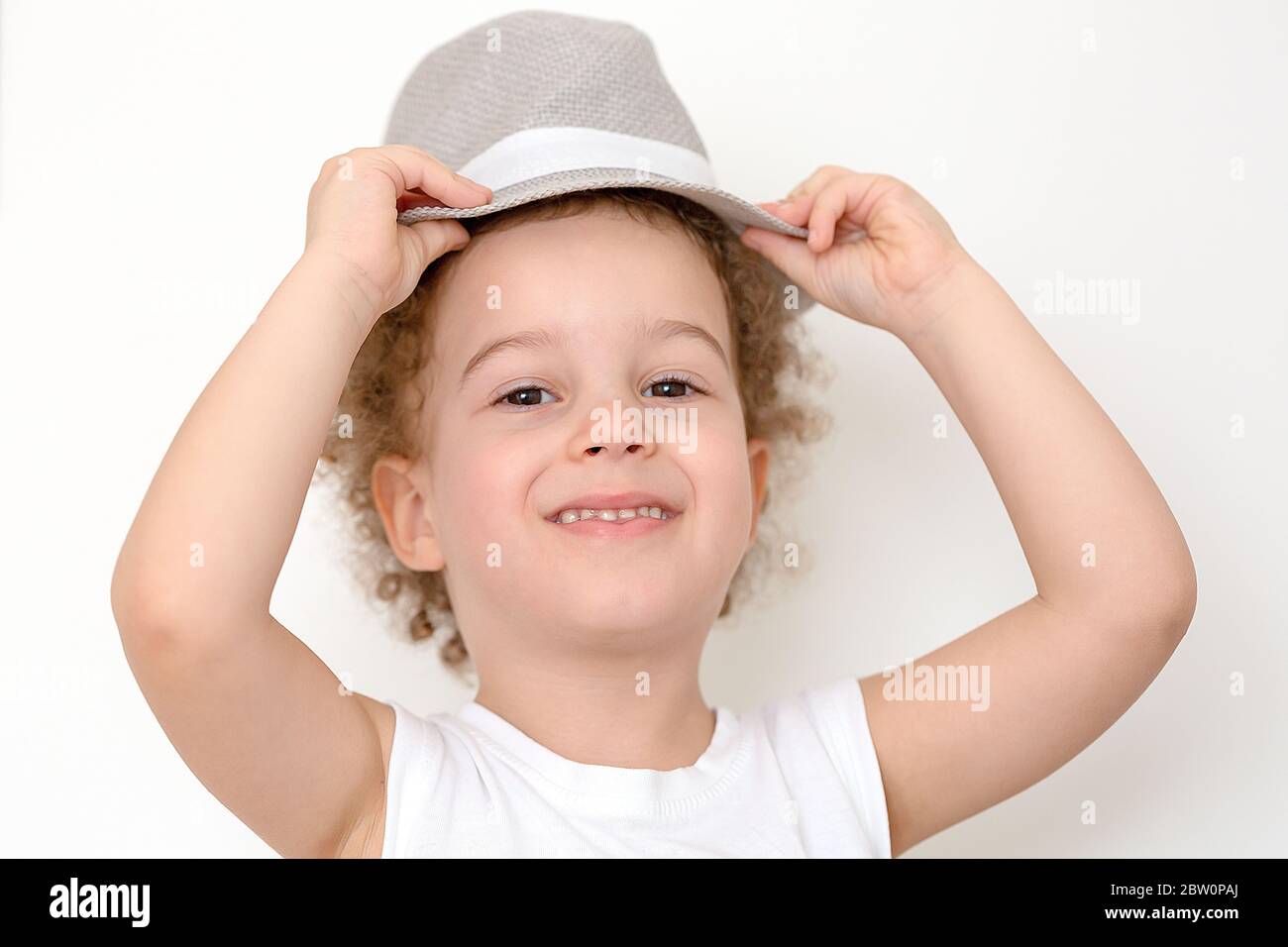 Happy boy in straw hat over white background Stock Photo - Alamy