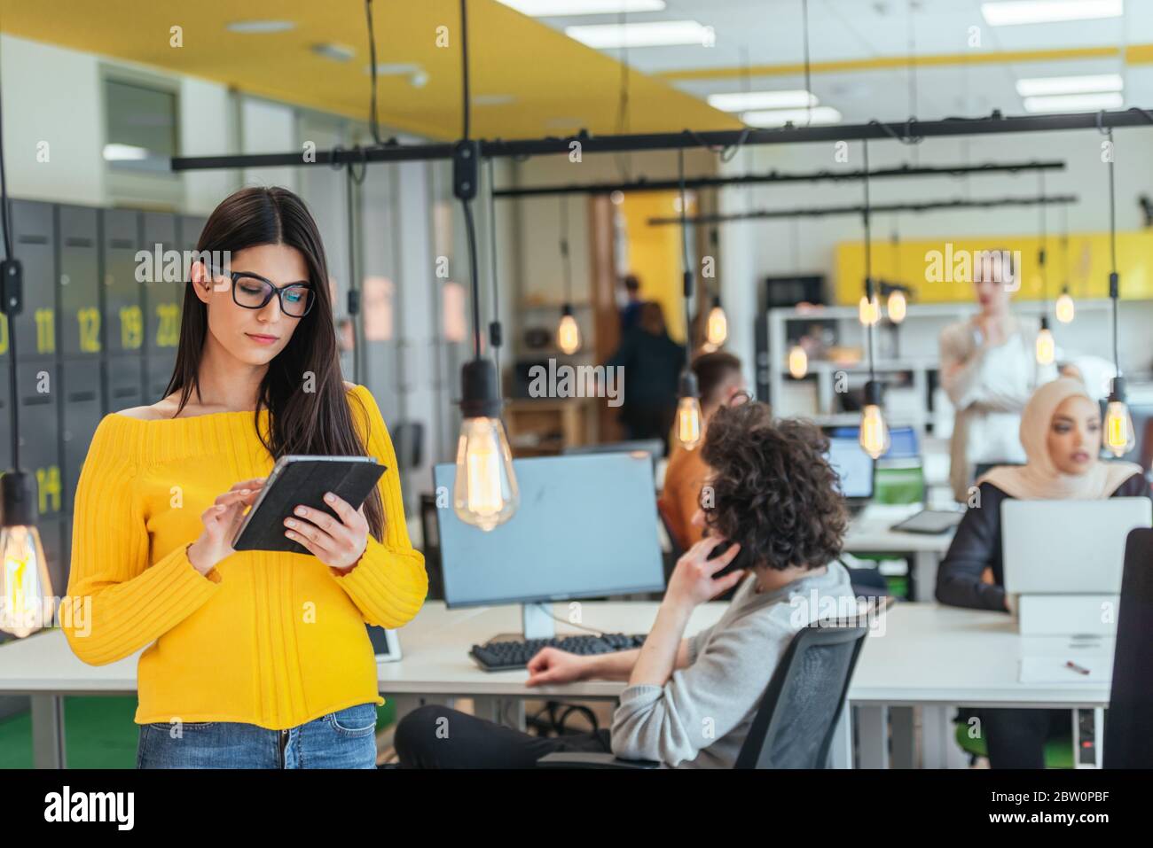 Female boss, manager executive posing in a modern startup office while ...
