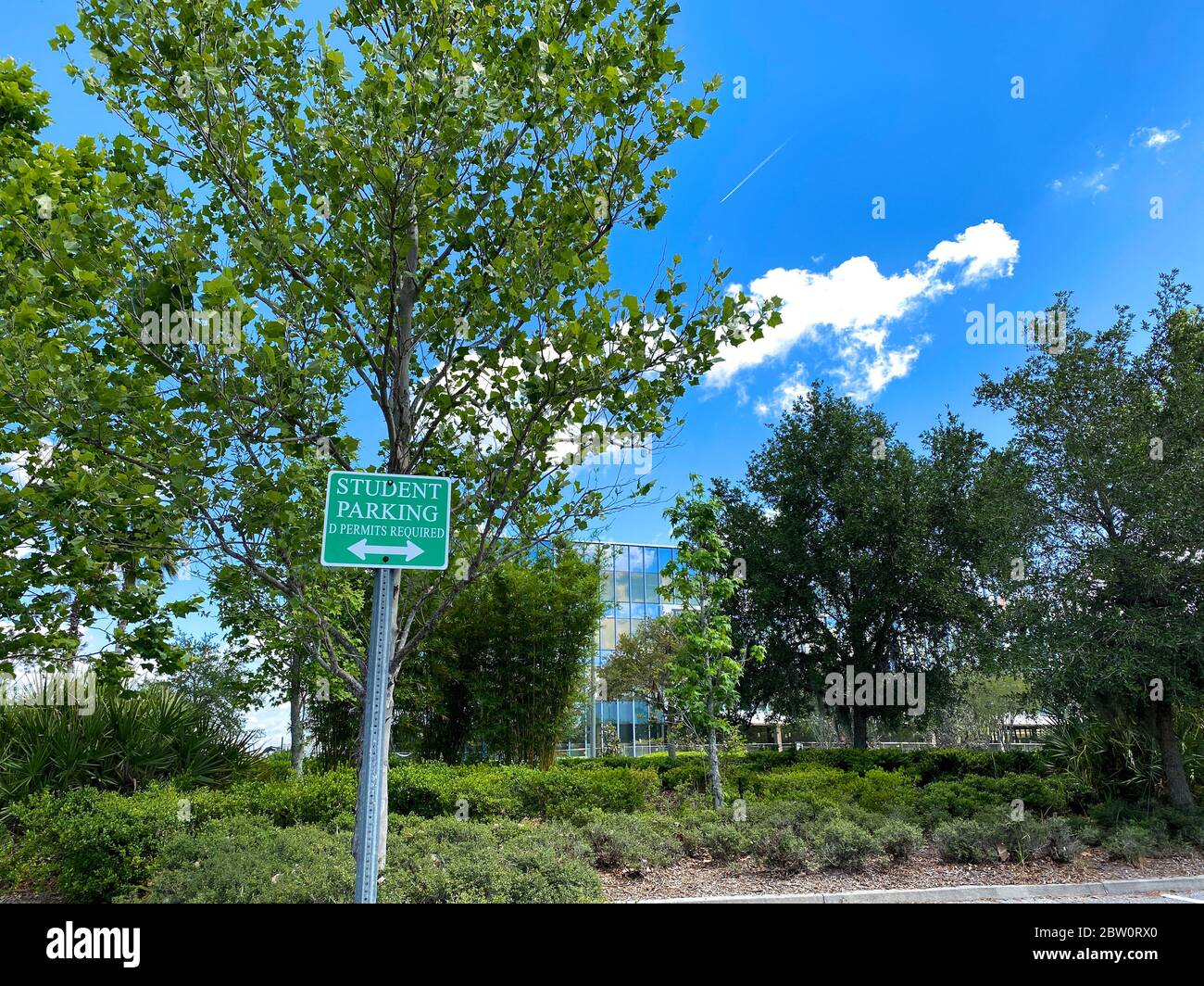 A student parking sign in a parking lot of a university office building ...