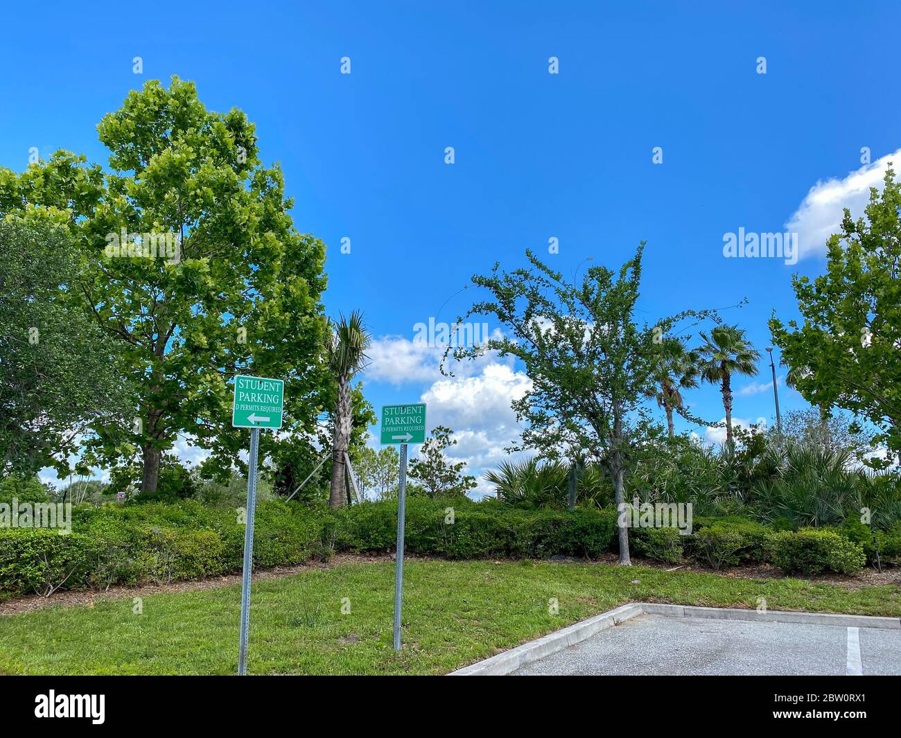 A student parking sign in a parking lot of a university office building ...