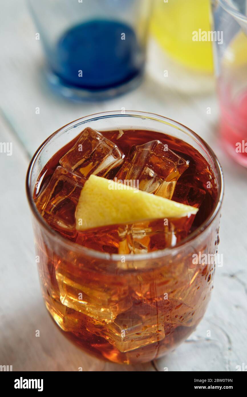 very cold cola on a white background with ice and lemon Stock Photo - Alamy