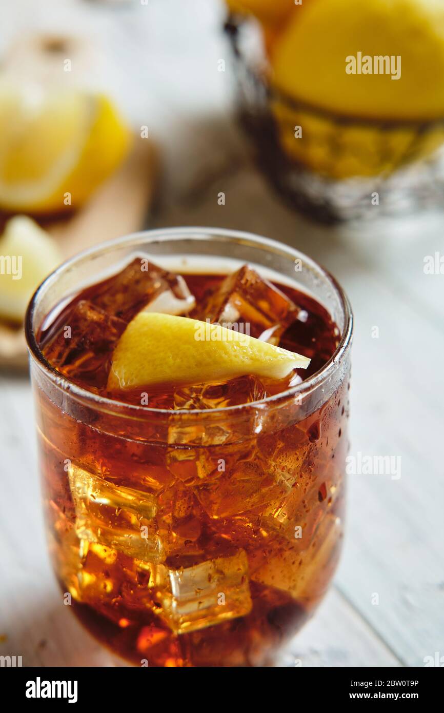 very cold cola on a white background with ice and lemon Stock Photo - Alamy
