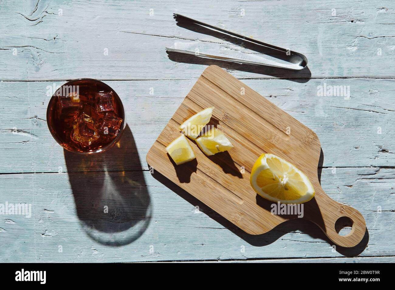 very cold cola on a white background with ice and lemon Stock Photo - Alamy