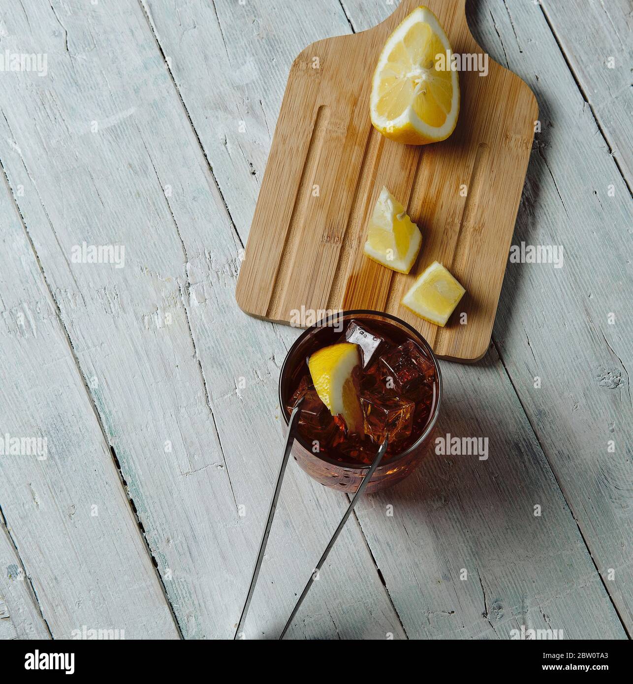 very cold cola on a white background with ice and lemon Stock Photo - Alamy