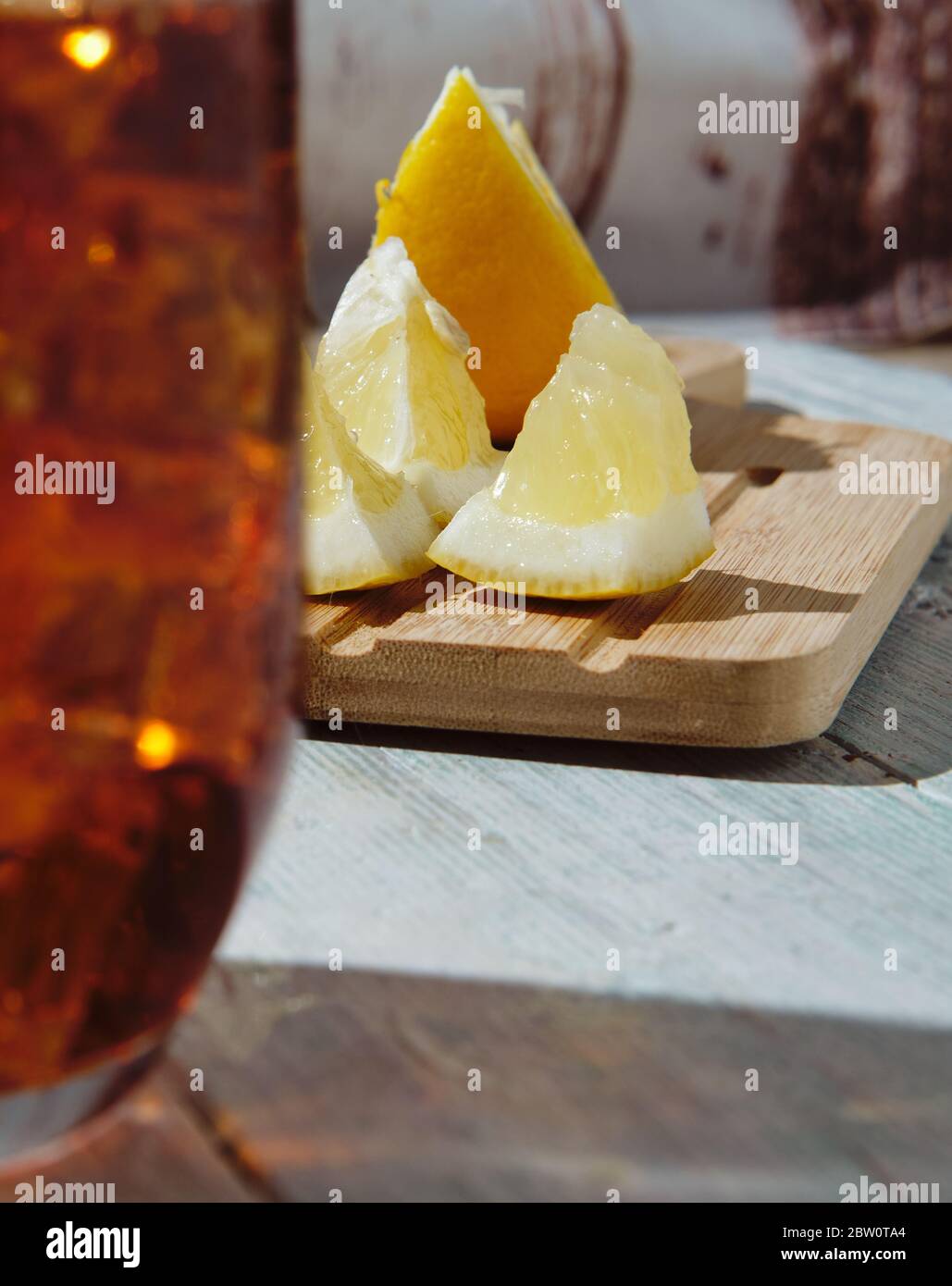 very cold cola on a white background with ice and lemon Stock Photo - Alamy