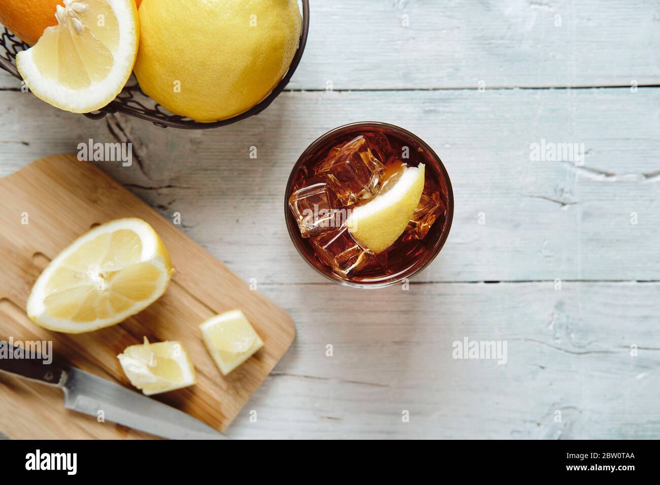 very cold cola on a white background with ice and lemon Stock Photo - Alamy