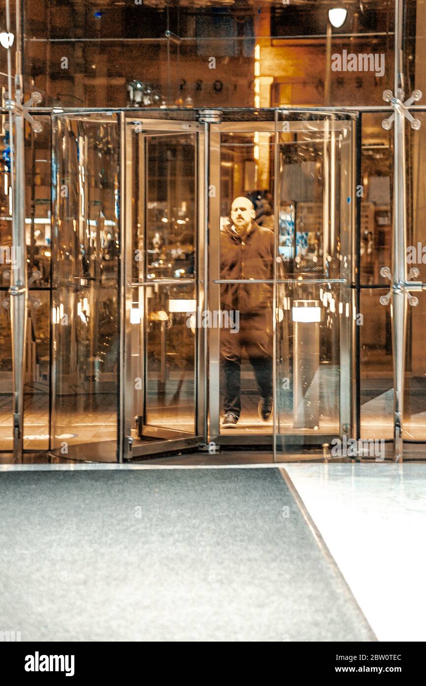 Man entering building through hi-res stock photography and images - Alamy