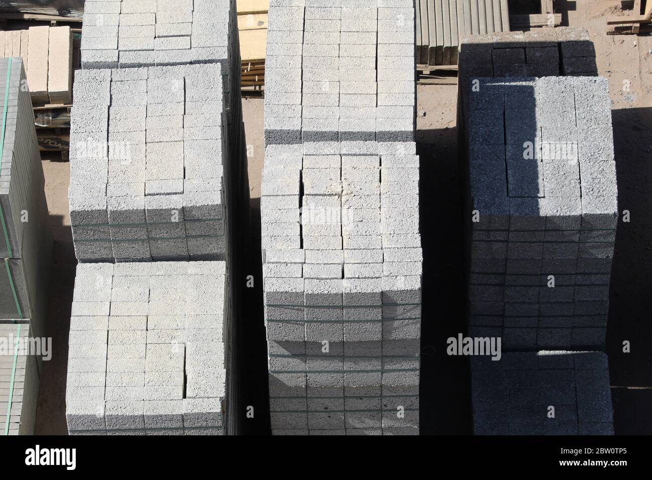 Large stacks of concrete bricks at an building supplier Stock Photo - Alamy