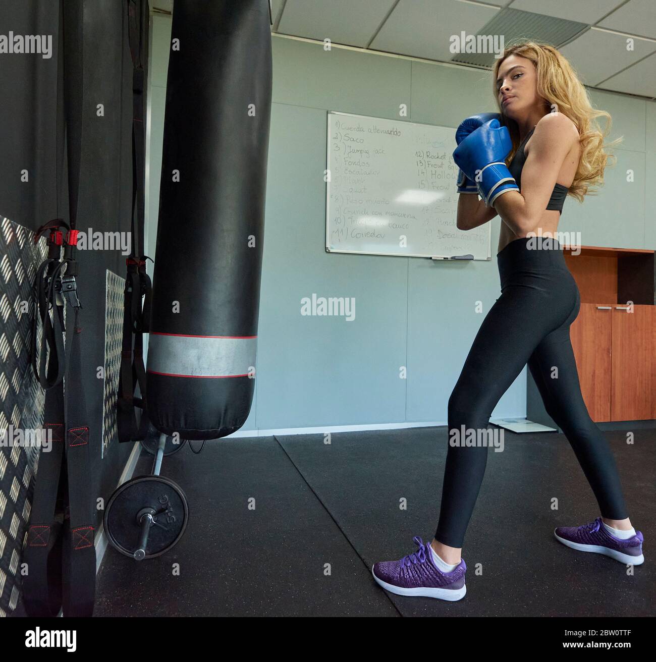 Side view of confident female boxer exercising in gym Stock Photo - Alamy