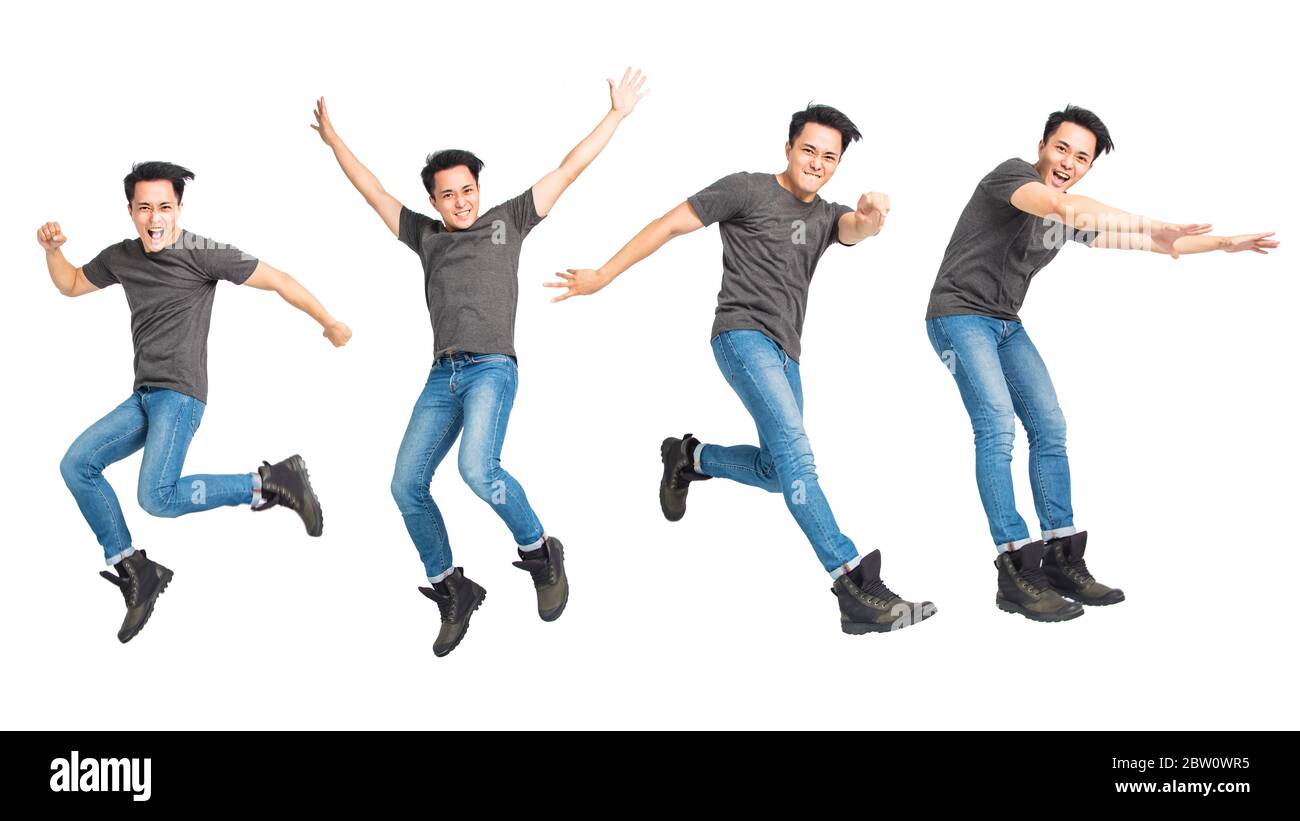 cheerful young man jumping over white background Stock Photo - Alamy