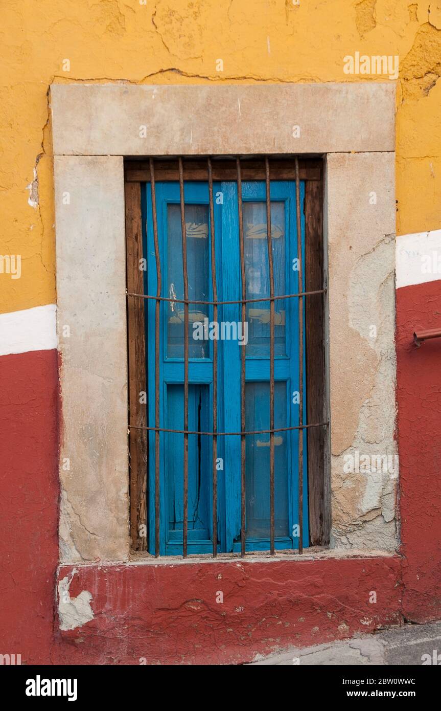 Blue wooden window in a colorful old house Stock Photo - Alamy