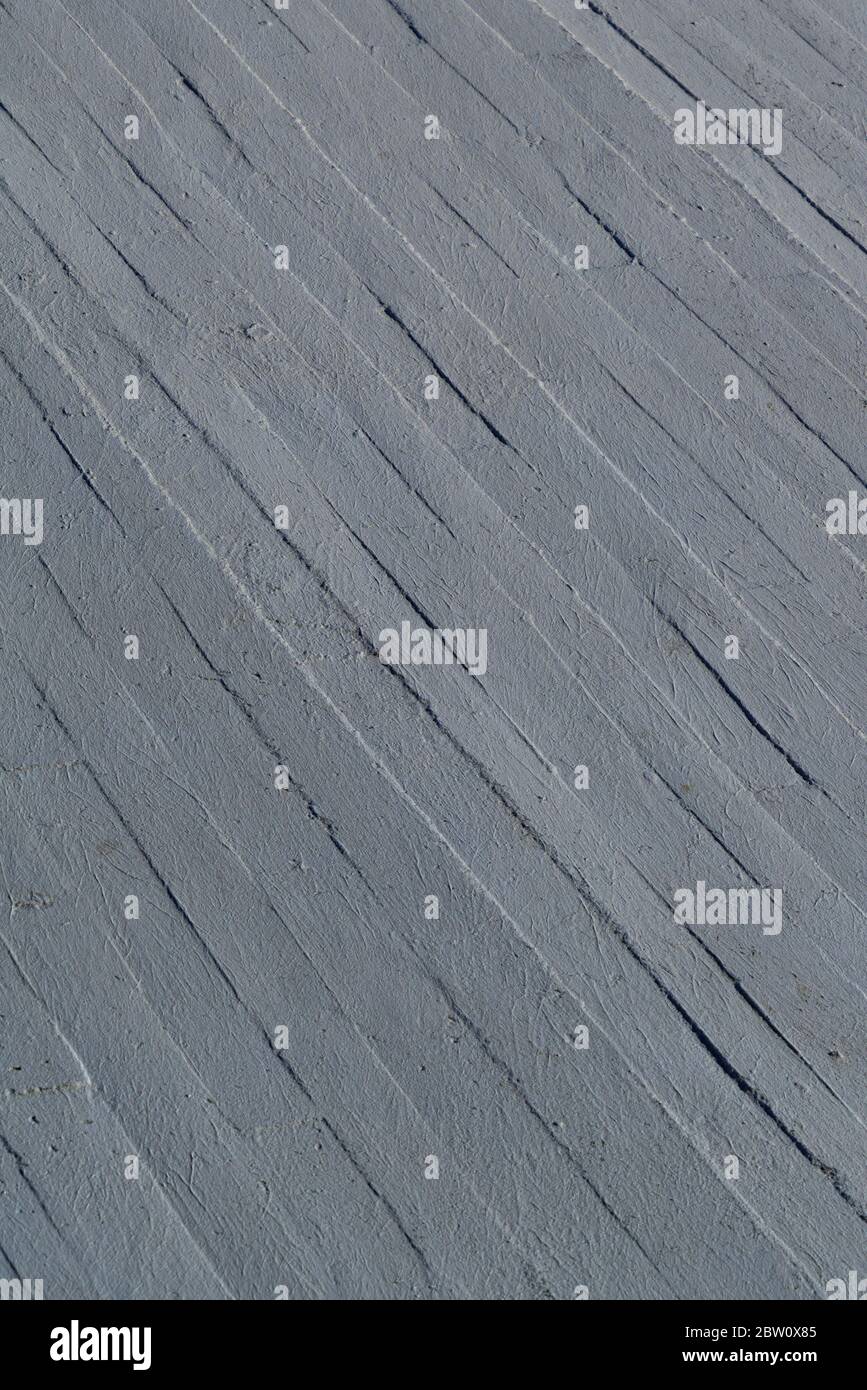 Abstract detail of diagonal linear pattern on light concrete surface ...